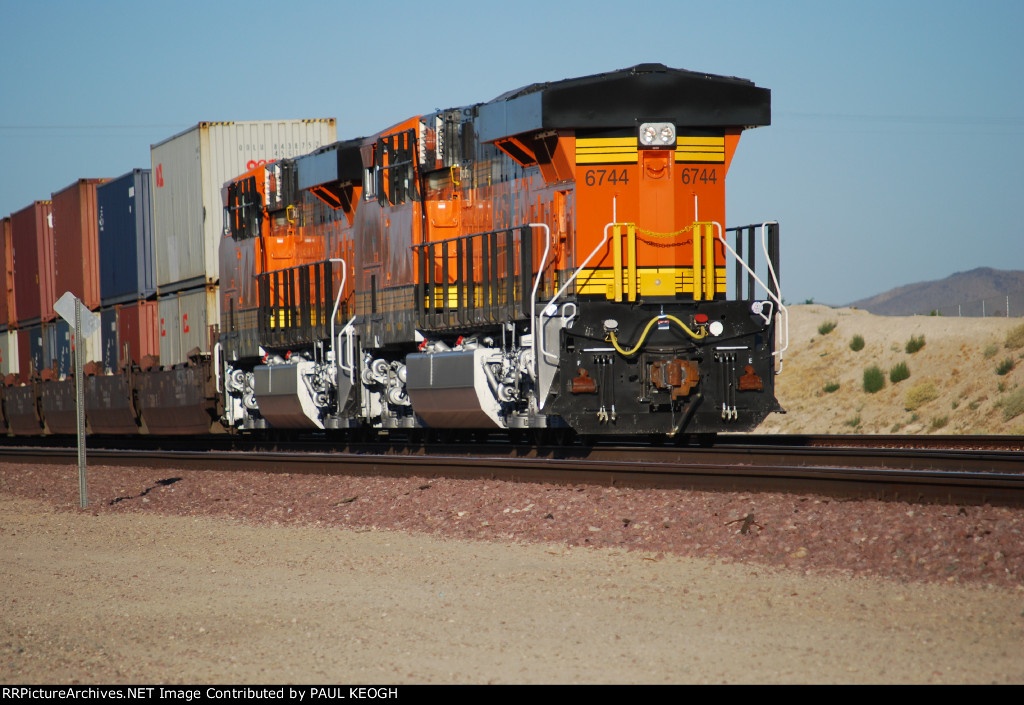 Two Very Brand New C4's head west as the Sun Reflects off their Very Brand New BNSF Swoosh Logo ...